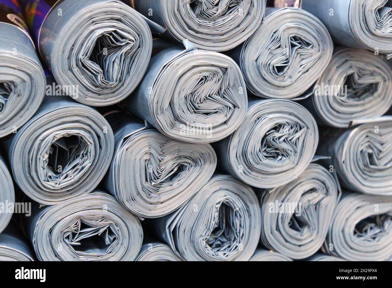 Gray Plastic rolls stacked in a disorderly manner, creating a sound of ...