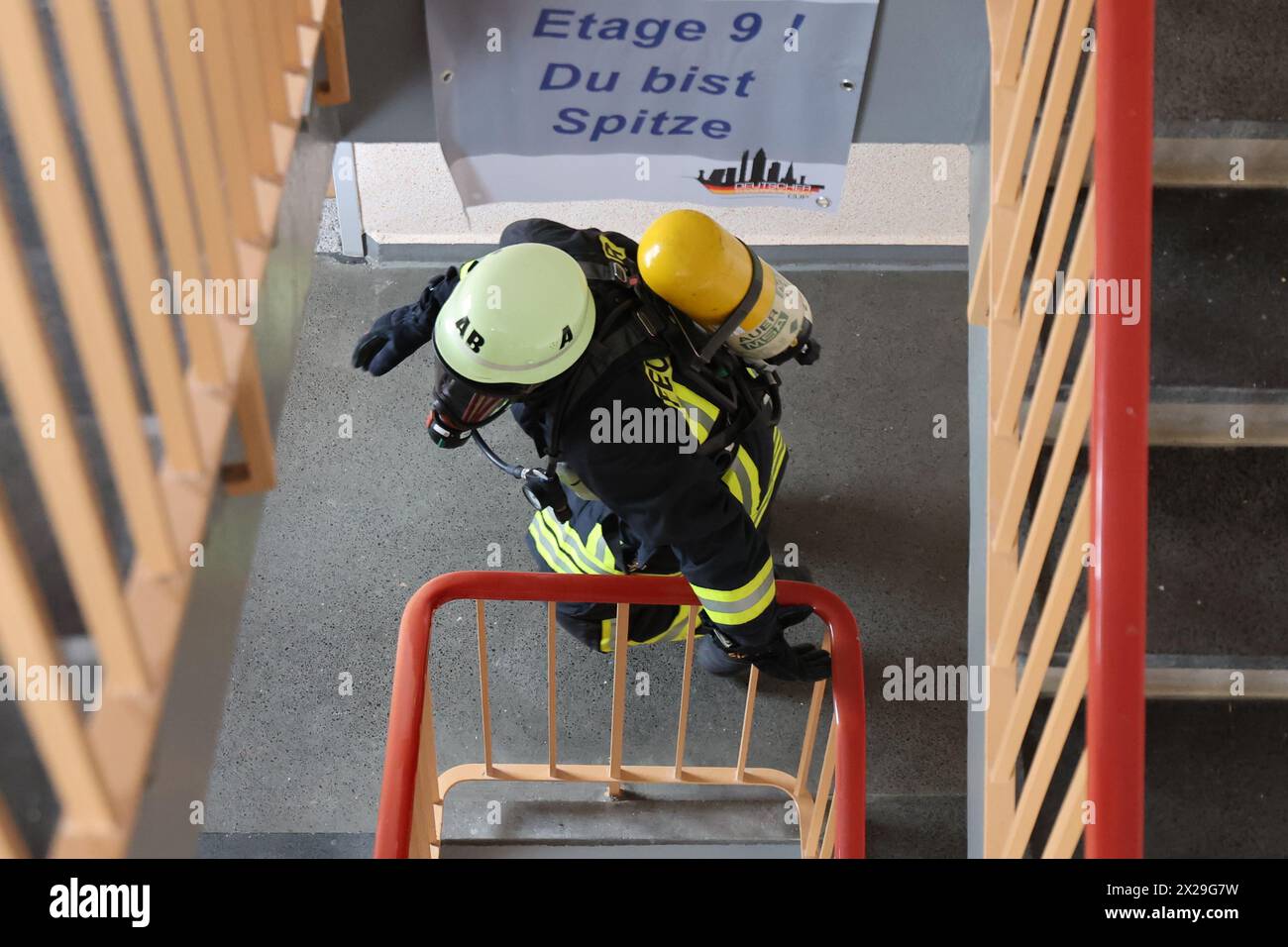 Zwickau, Germany. 21st Apr, 2024. A firefighter with breathing mask and ...