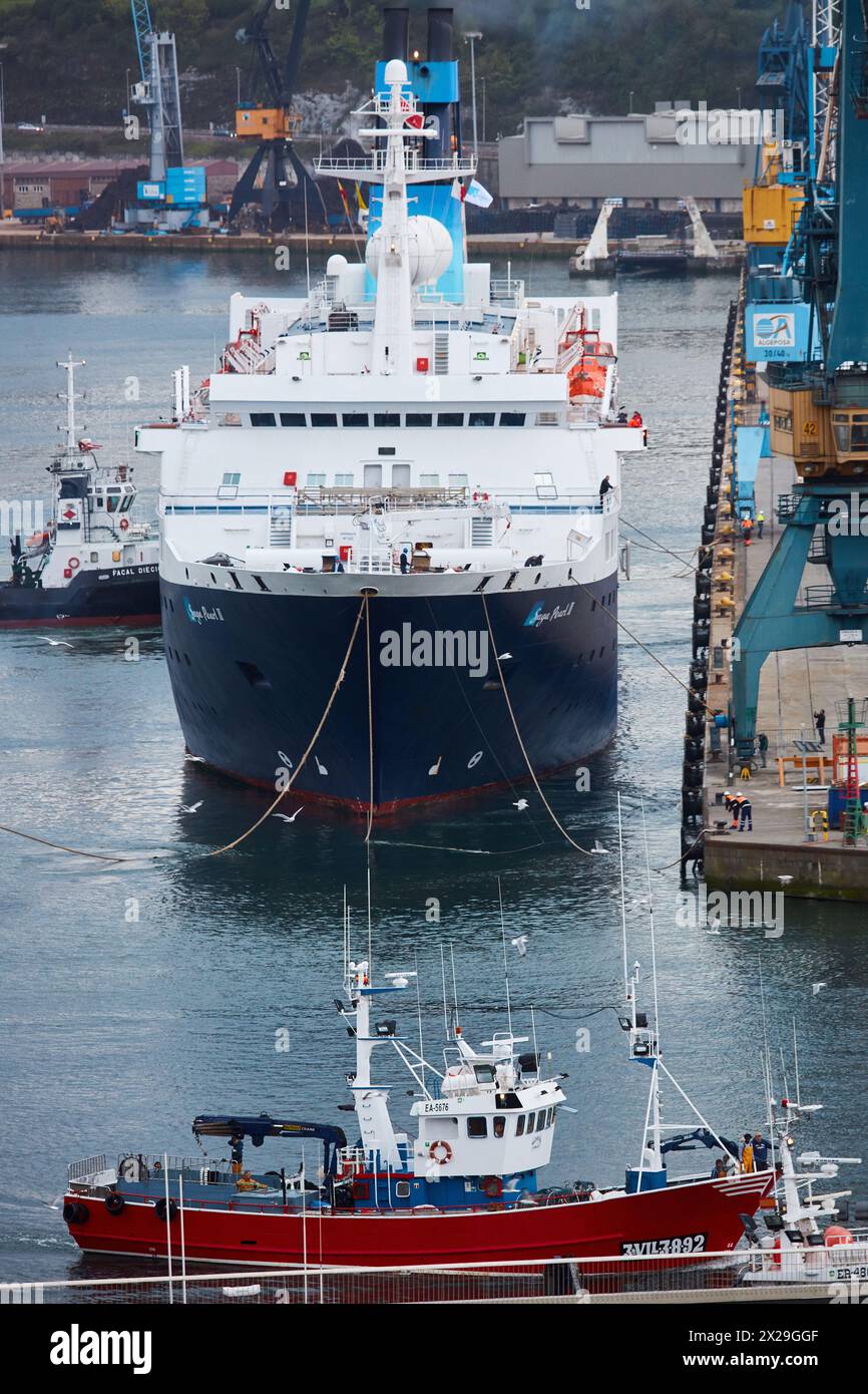 Berthing. Tugboat and cruise liner. Passenger ship. Tug maneuvers ...