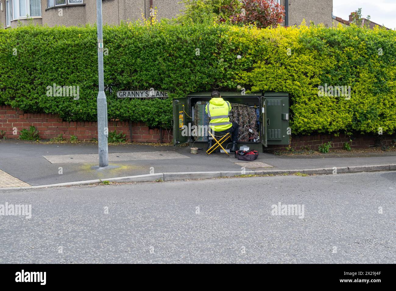 Engineer working on a BT junction box Stock Photo - Alamy
