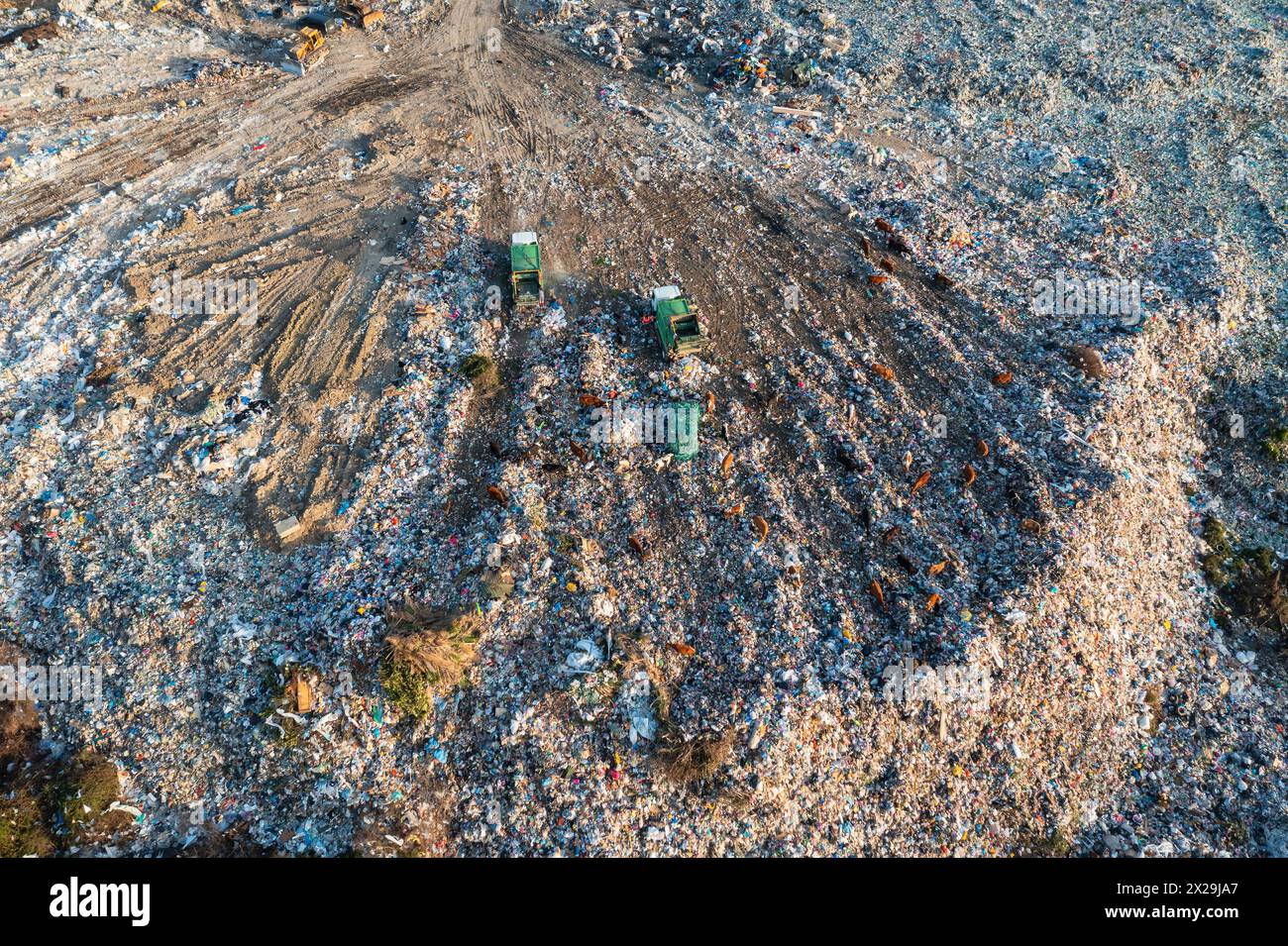 Rubbish dump. Aerial view of garbage pile in trash dump. Dump track ...