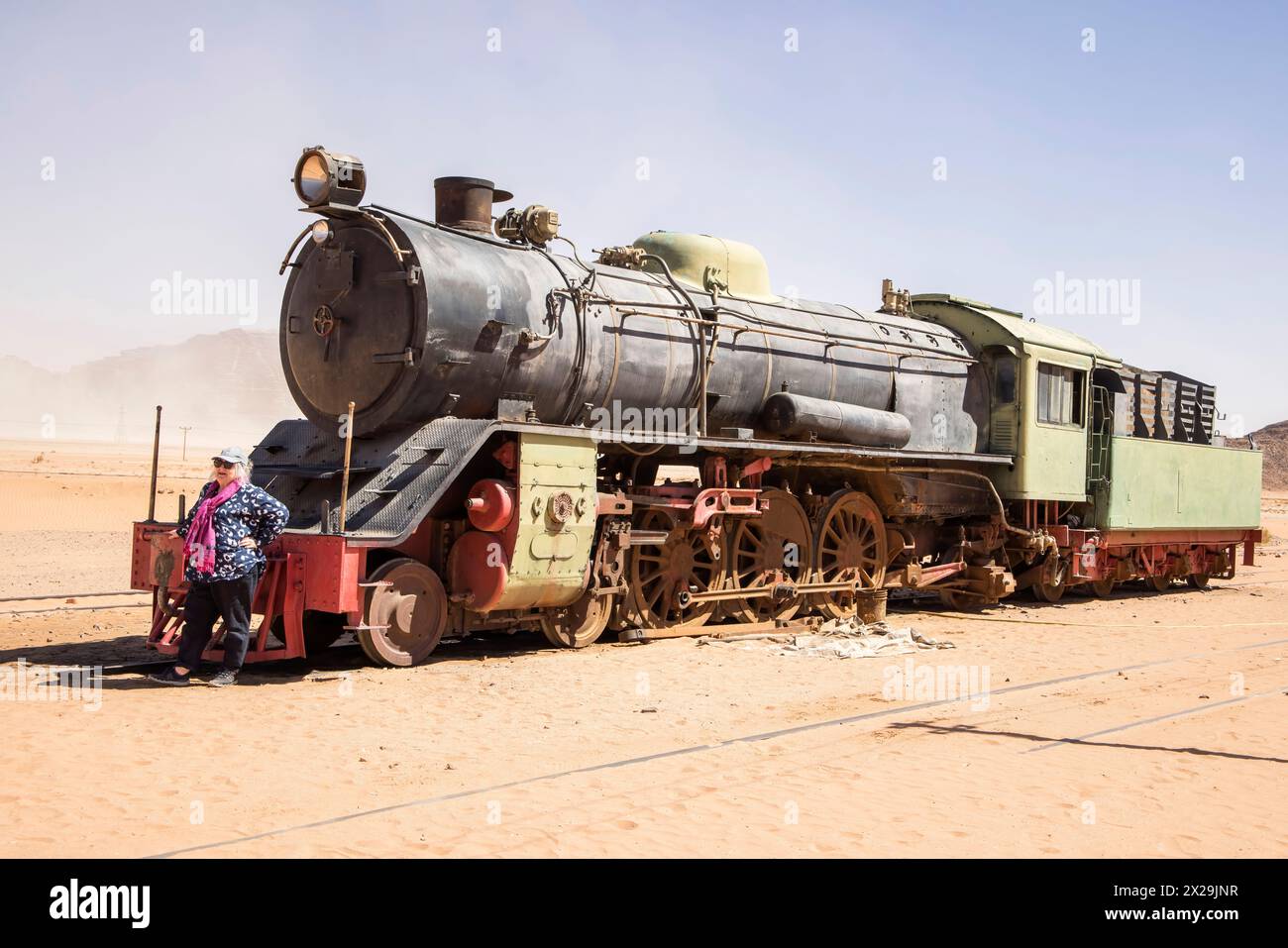 the hijaz railway station, steam train and tracks in the desert at wadi ...