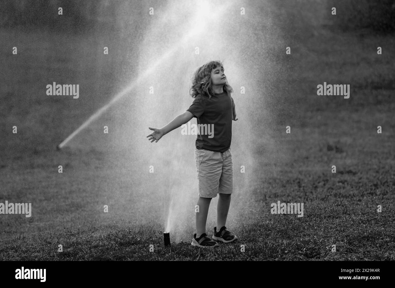 Cute little kid play in garden at summer day. Child enjoy summer in ...