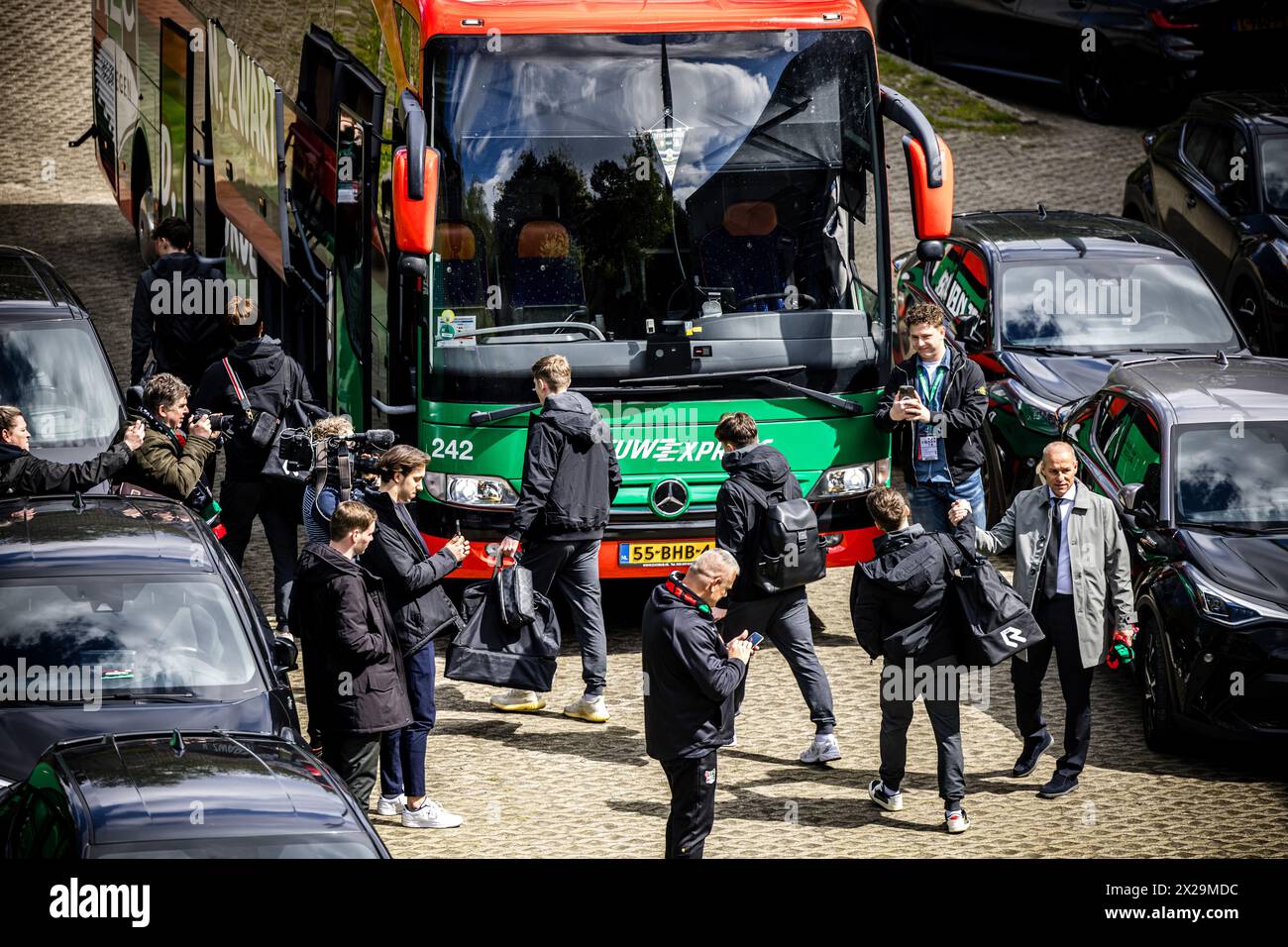 NIJMEGEN - Players at the departure of the NEC player bus to Rotterdam ...