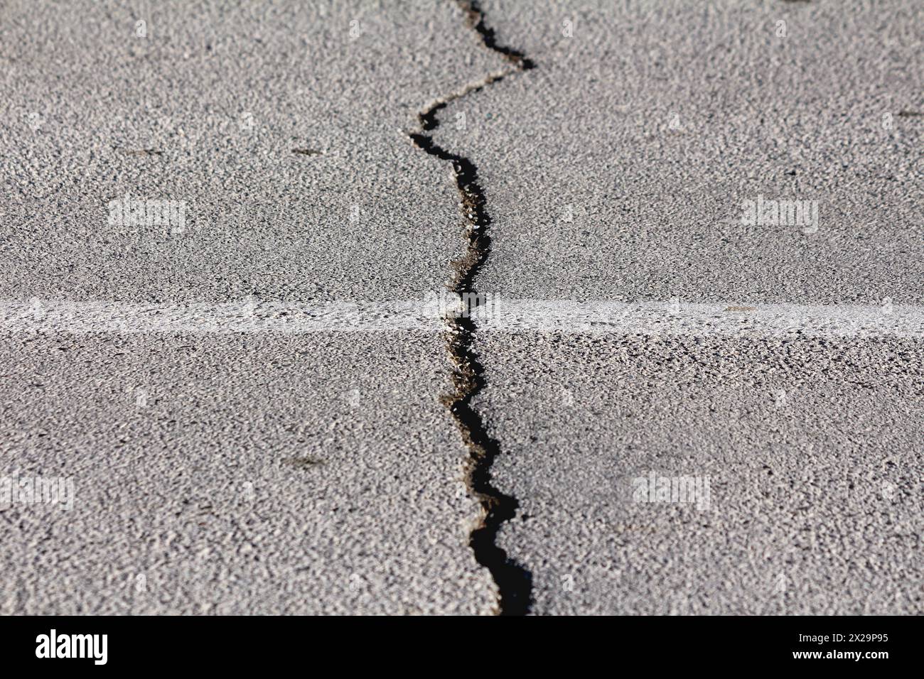 Large crack on public paved asphalt road that appeared after big ...