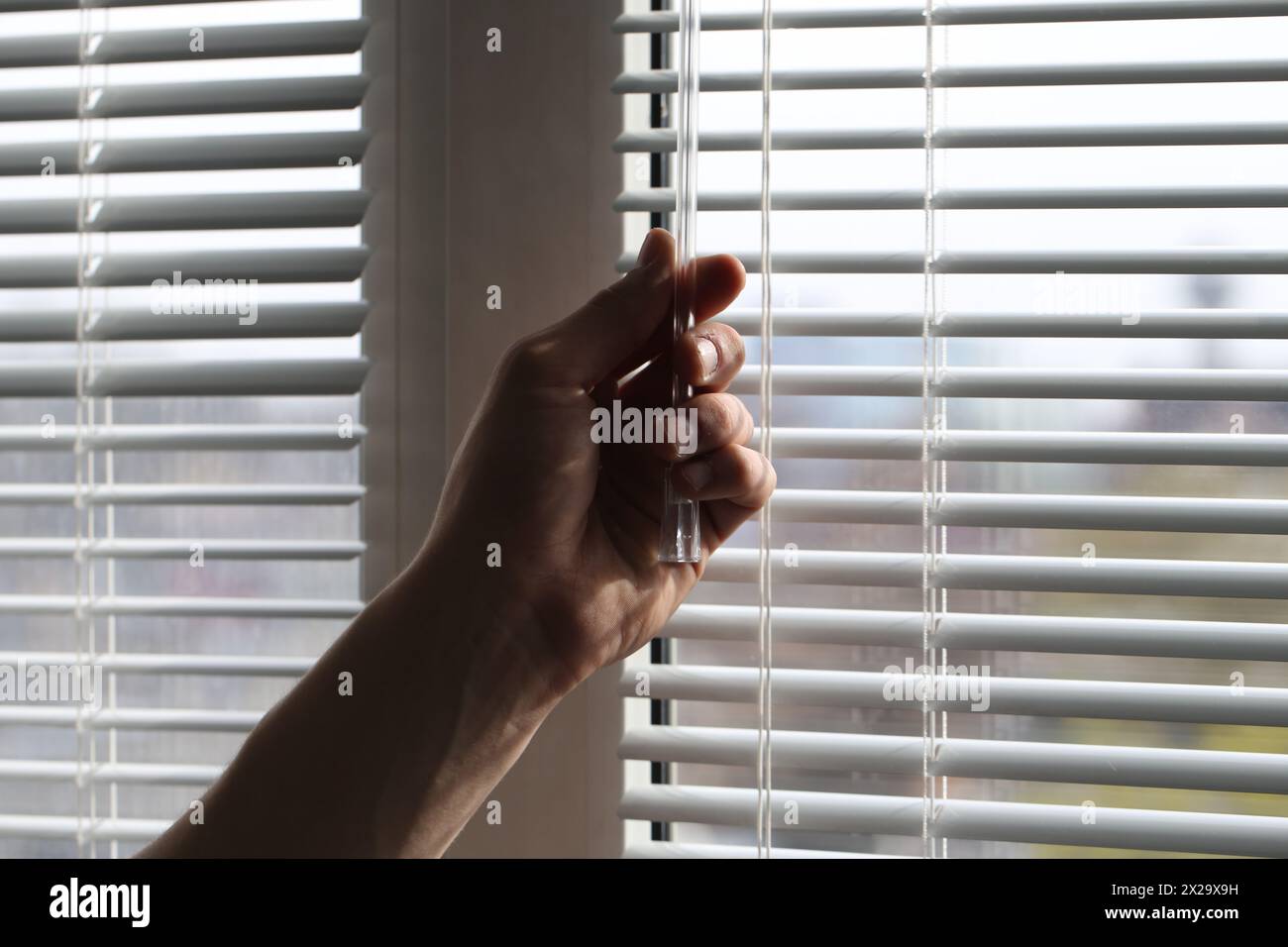 Man closing shutters hi-res stock photography and images - Alamy