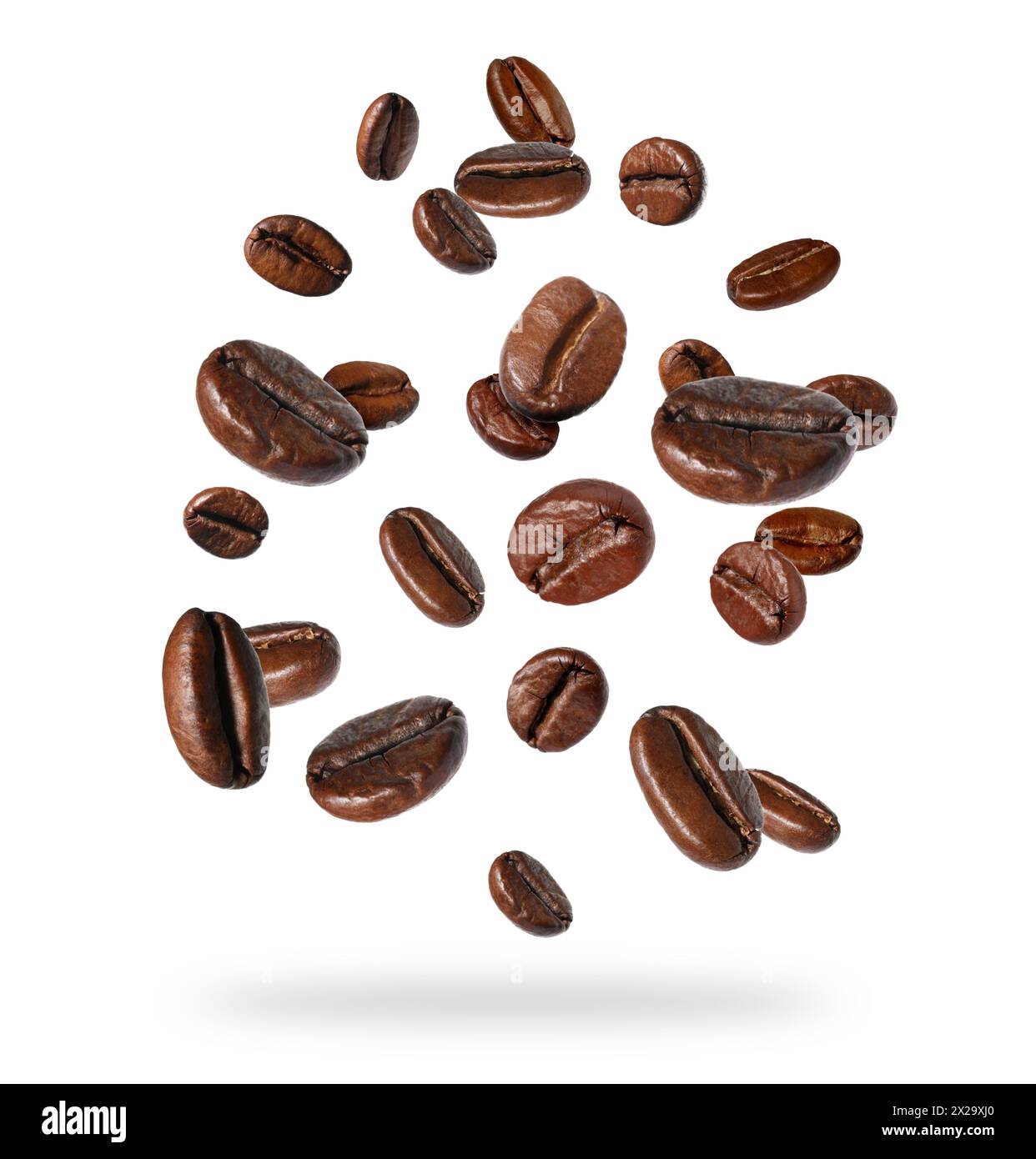 Roasted coffee beans falling on white background Stock Photo - Alamy