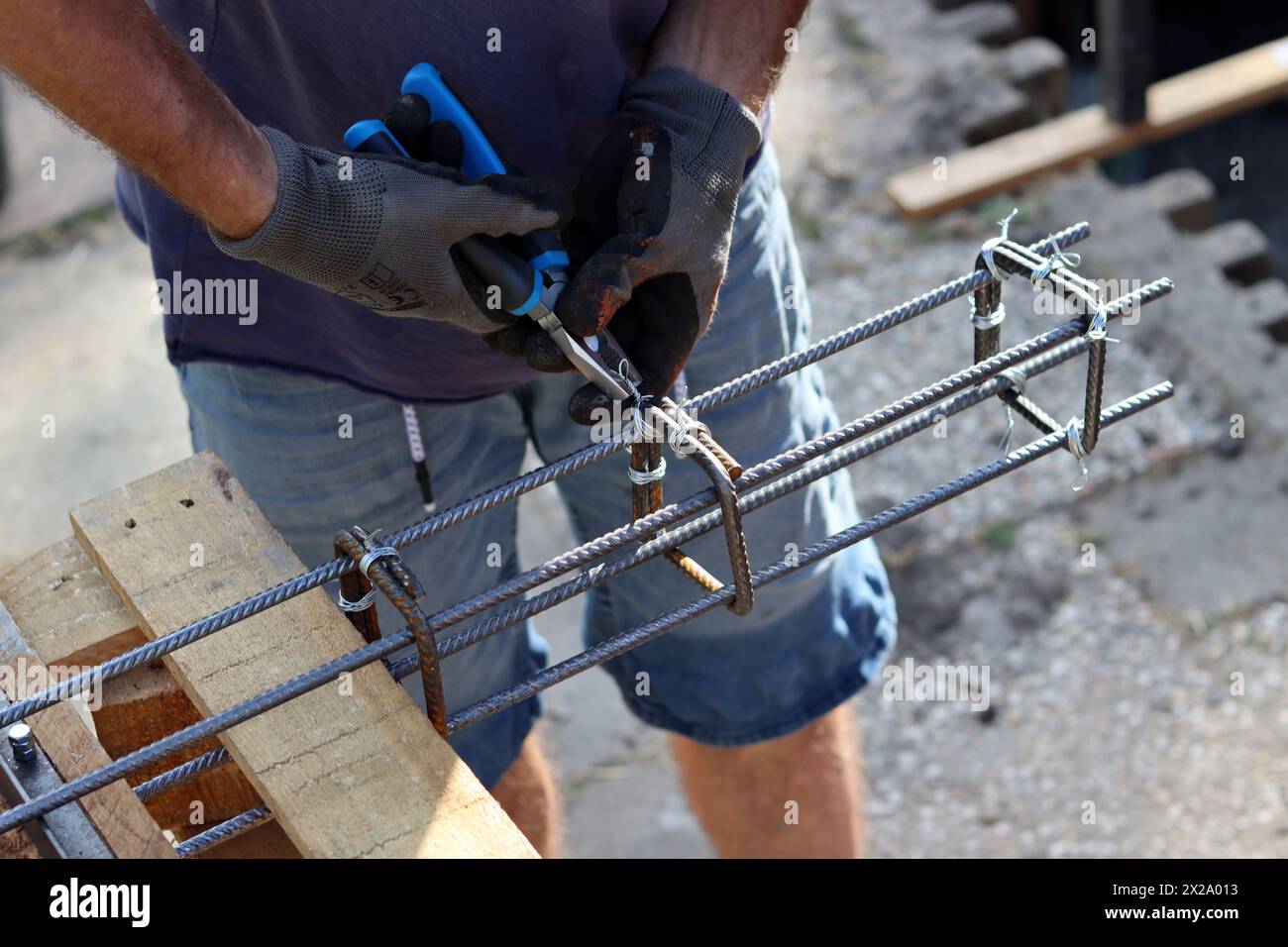 Professional builder works with reinforcement steel. Construction work ...