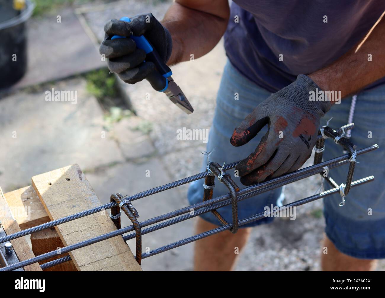 Professional builder works with reinforcement steel. Construction work ...