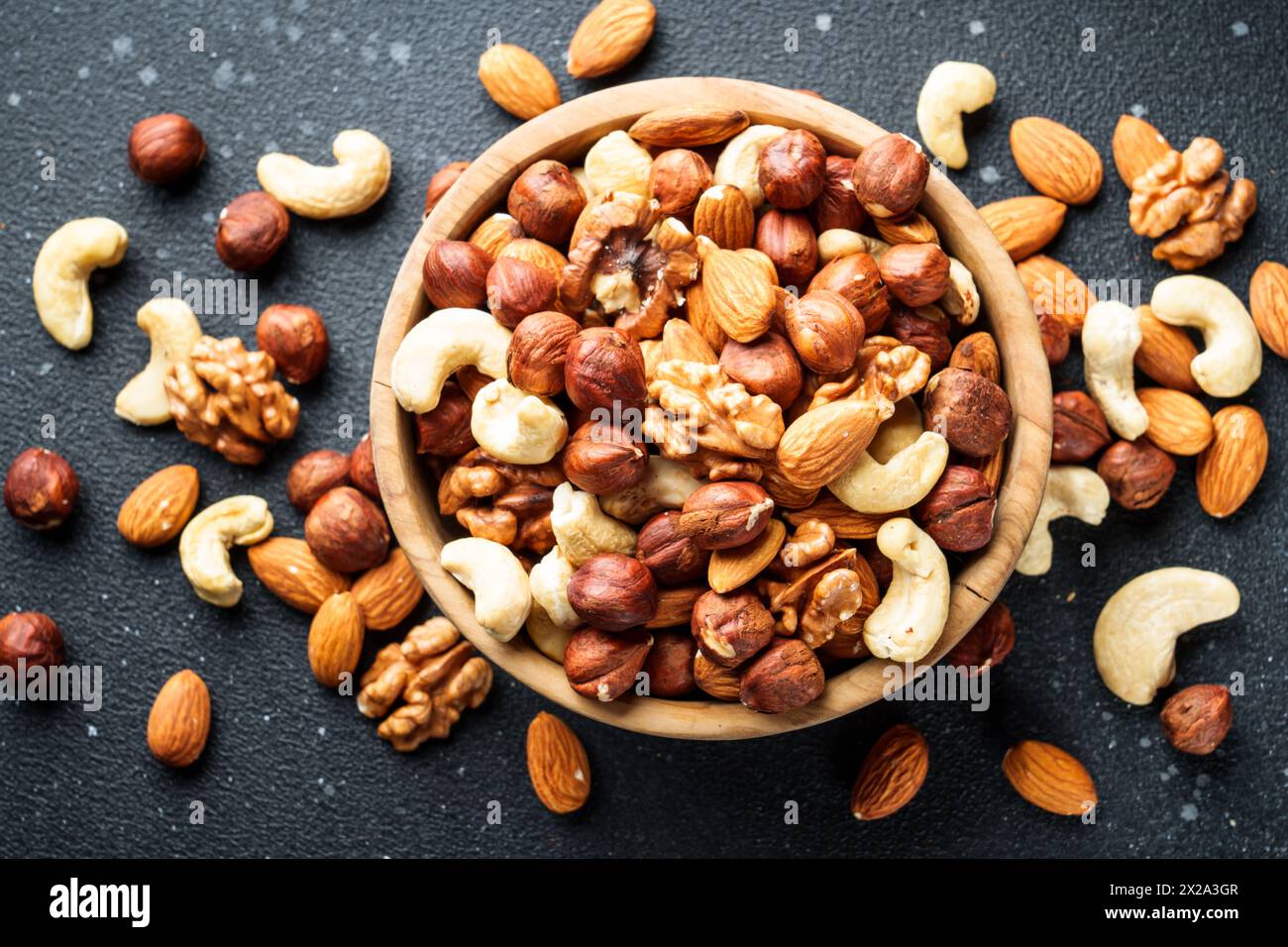 Nuts assortment at black background Stock Photo - Alamy