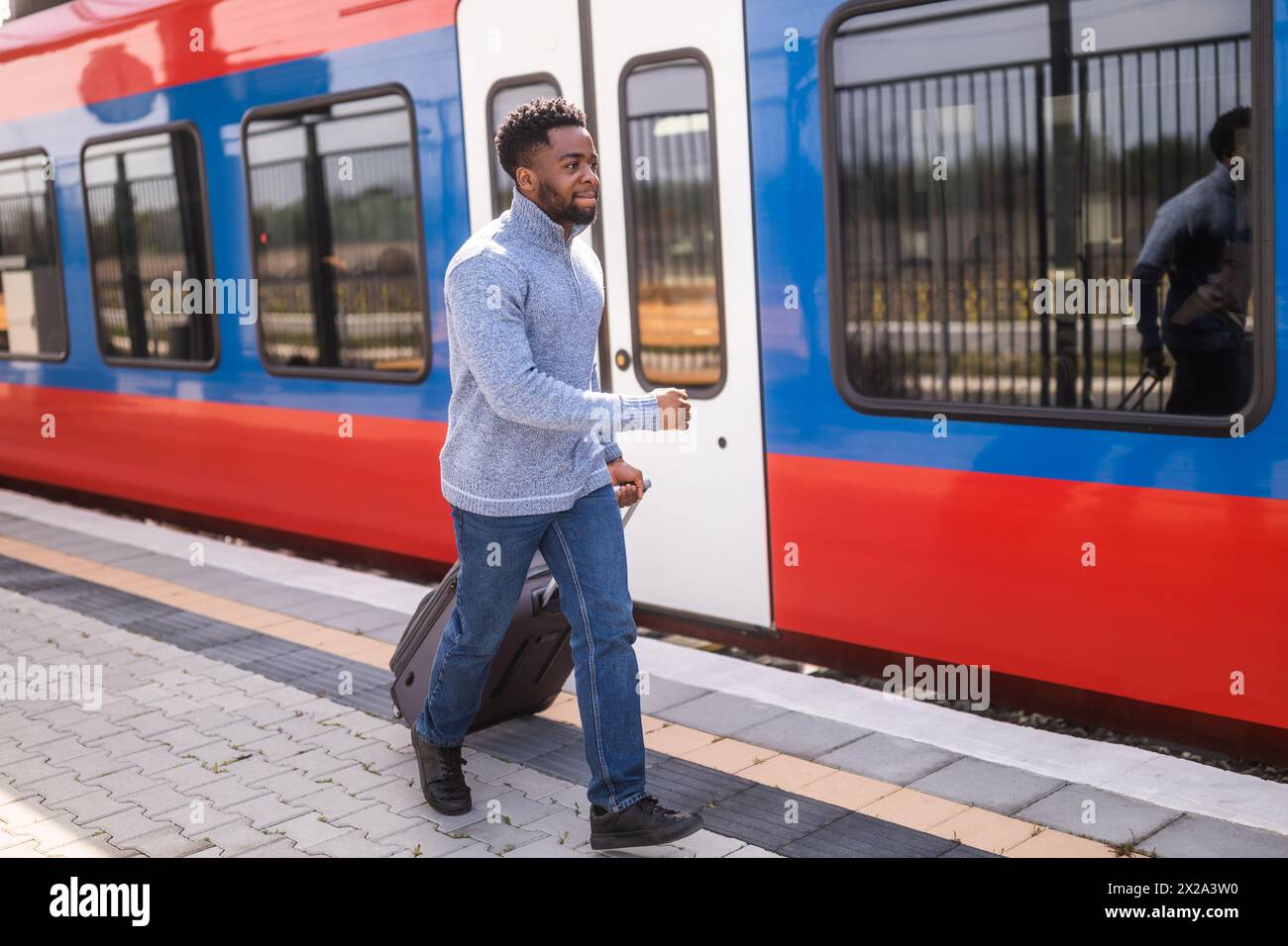 Man running train station hi-res stock photography and images - Alamy