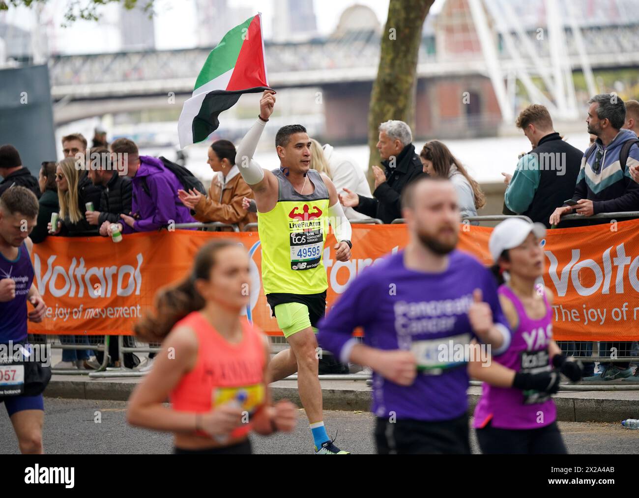 A runner with a Palestine flag on the Embankment during the TCS London ...