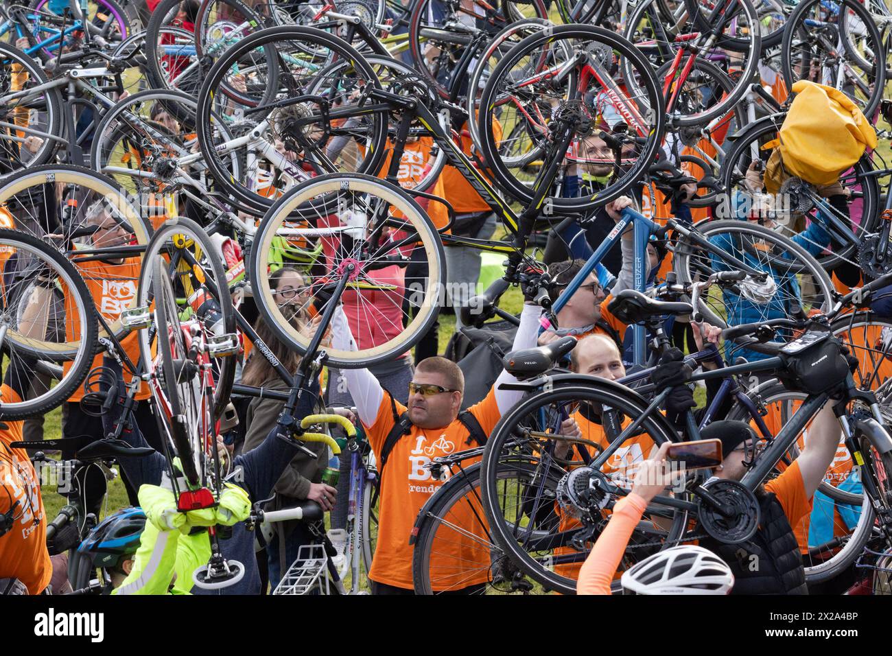 Budapest, Hungary. 20th Apr, 2024. People lift their bikes during the I ...