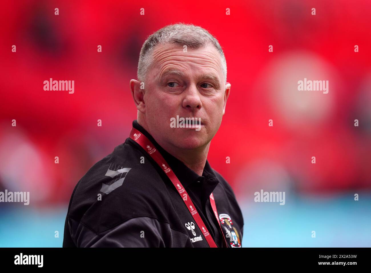 Coventry City manager Mark Robins inspects the pitch ahead of the ...