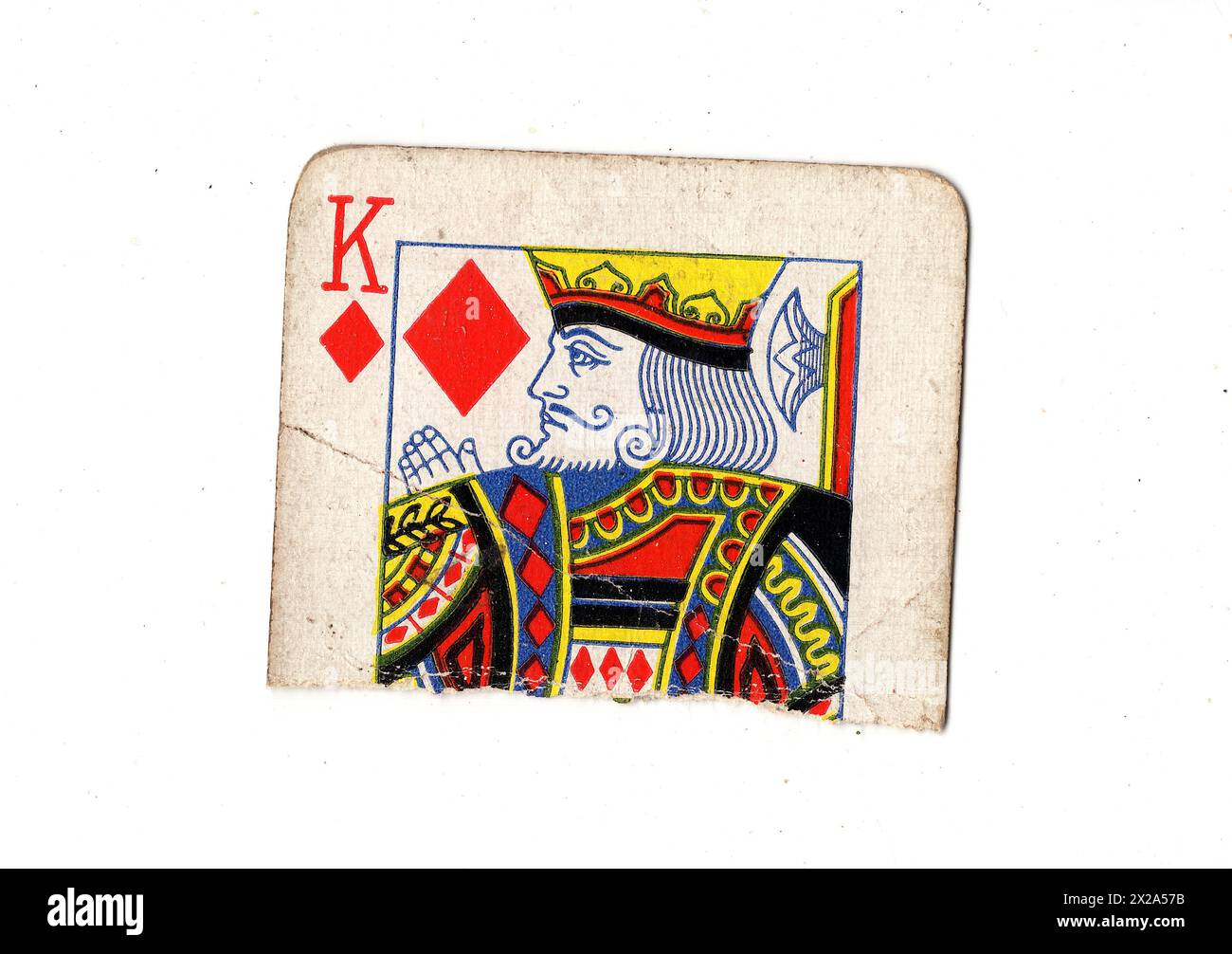 A torn half of a vintage, well used king of diamonds playing card ...