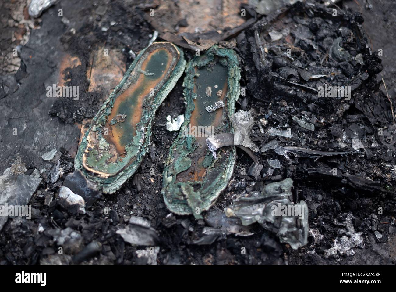 old burnt shoes in ashes Stock Photo - Alamy