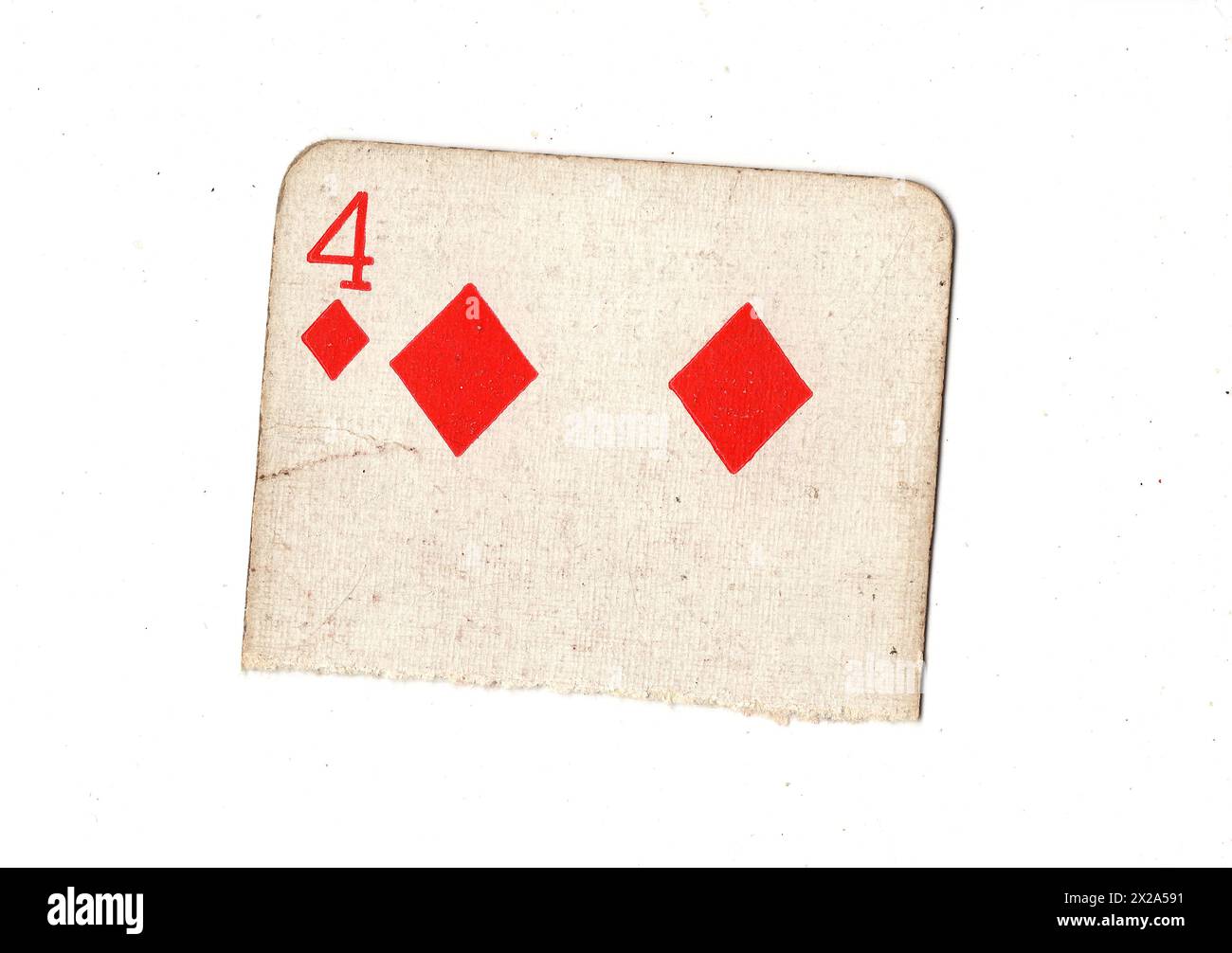 A torn half of a vintage, well used four of diamonds playing card ...