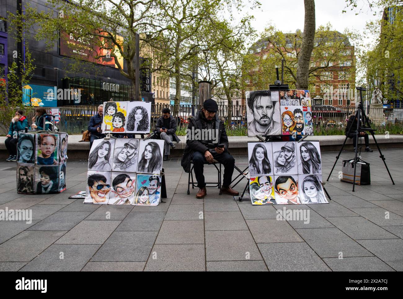 Street artist painter sketcher at Piccadilly Circus London Stock Photo ...