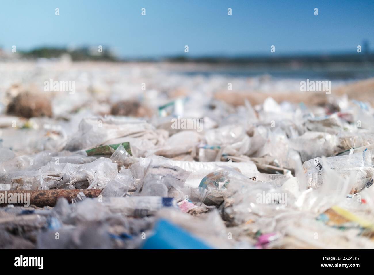 Close-up of a beach polluted with plastic waste Empty used dirty ...