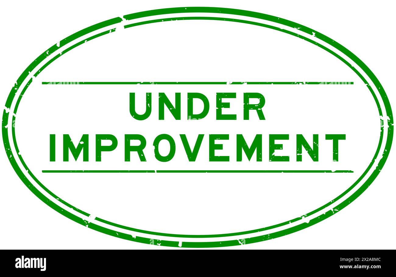 Grunge green under improvement word oval rubber seal stamp on white ...