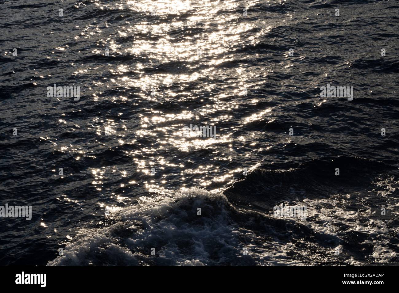 Lens star formed on water body on a sea, A calm ocean reflects sun ...