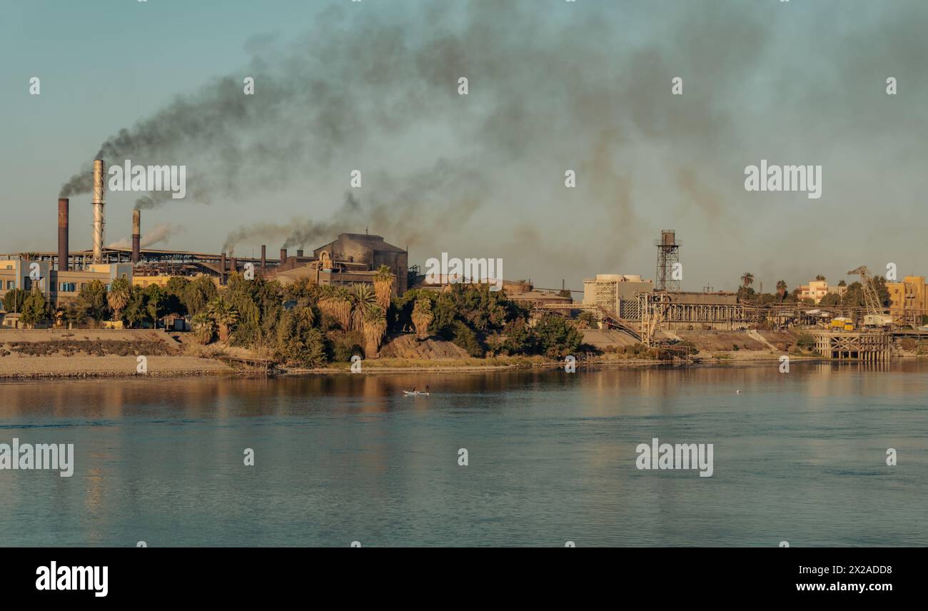 Black smoking sugar factory on the banks of the Nile Stock Photo - Alamy