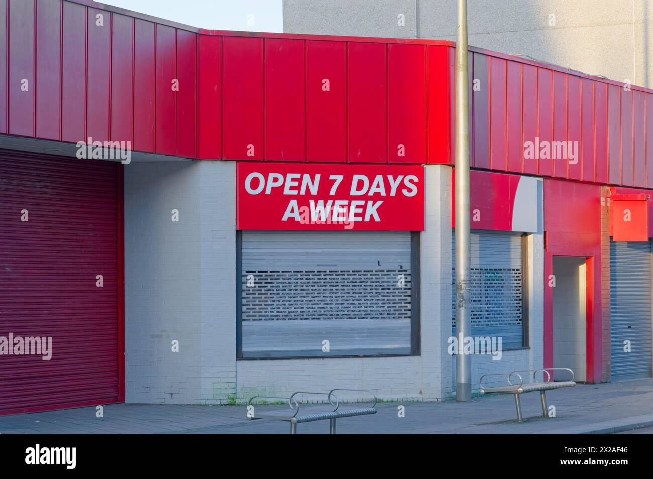 Open 7 days a week sign above business store front Stock Photo - Alamy