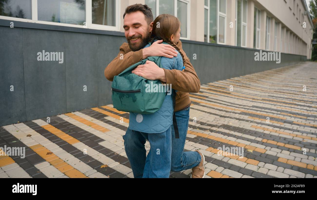Little girl running dad back to school schoolgirl student happiness joy ...
