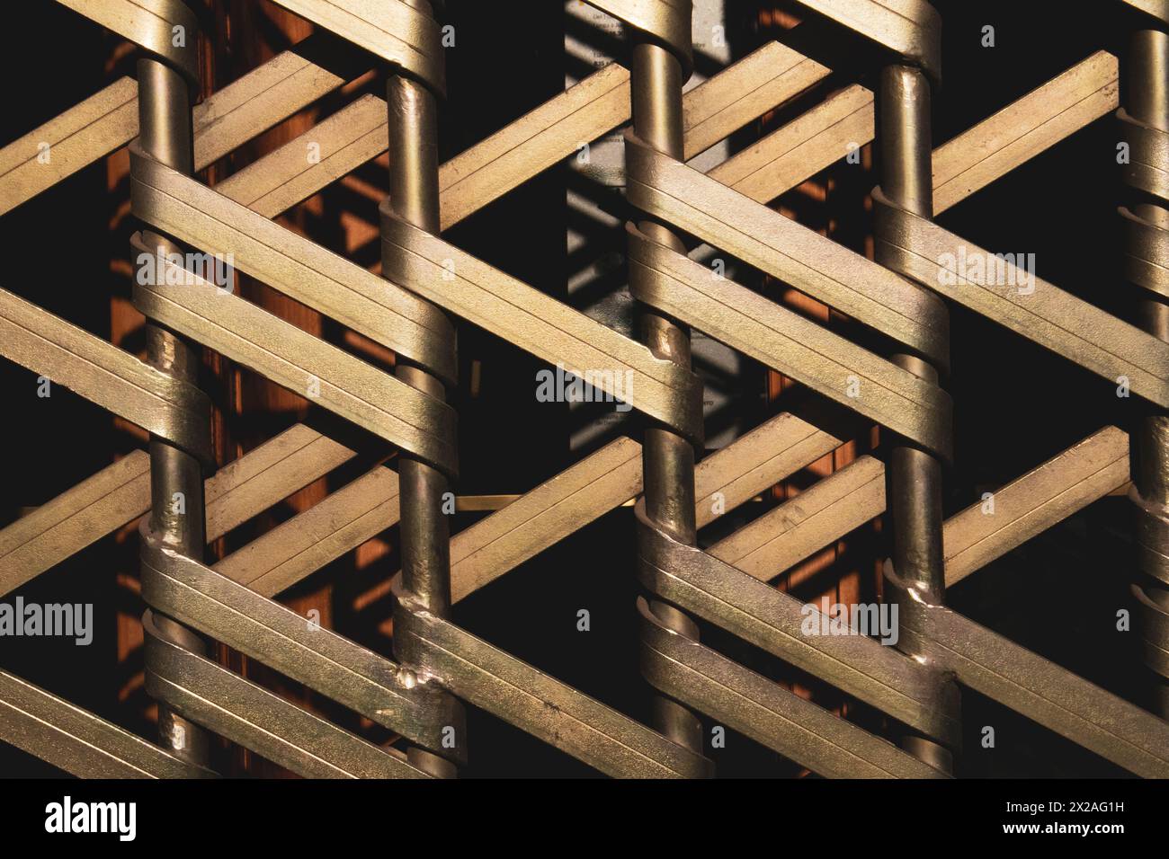 Detail and texture of golden metallic fence wave. Square iron mesh ...