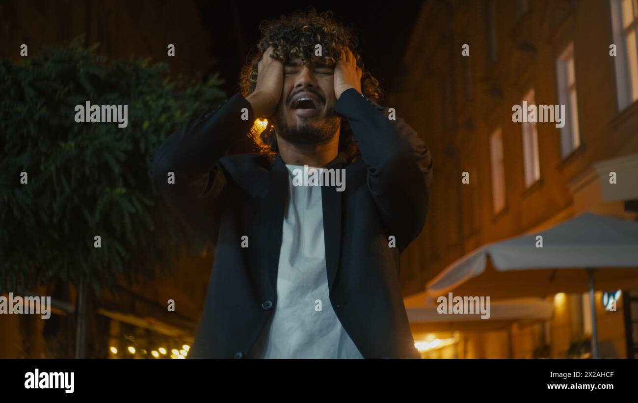 Upset Arabian Latino Indian American man outside city dissatisfied ...