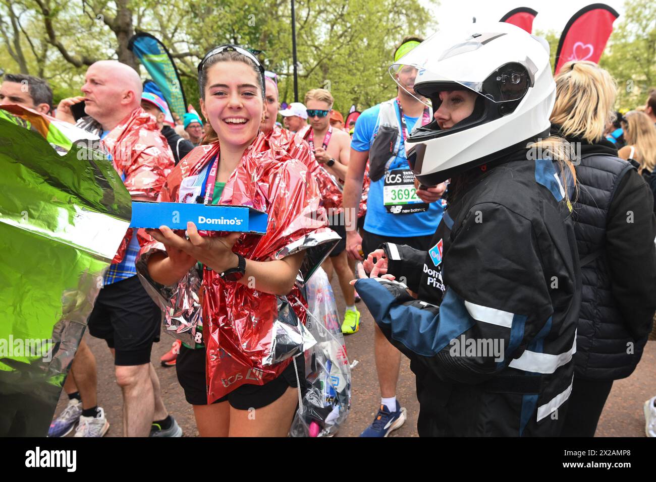EDITORIAL USE ONLY Runner Rachel from Surrey receives her Domino's ...