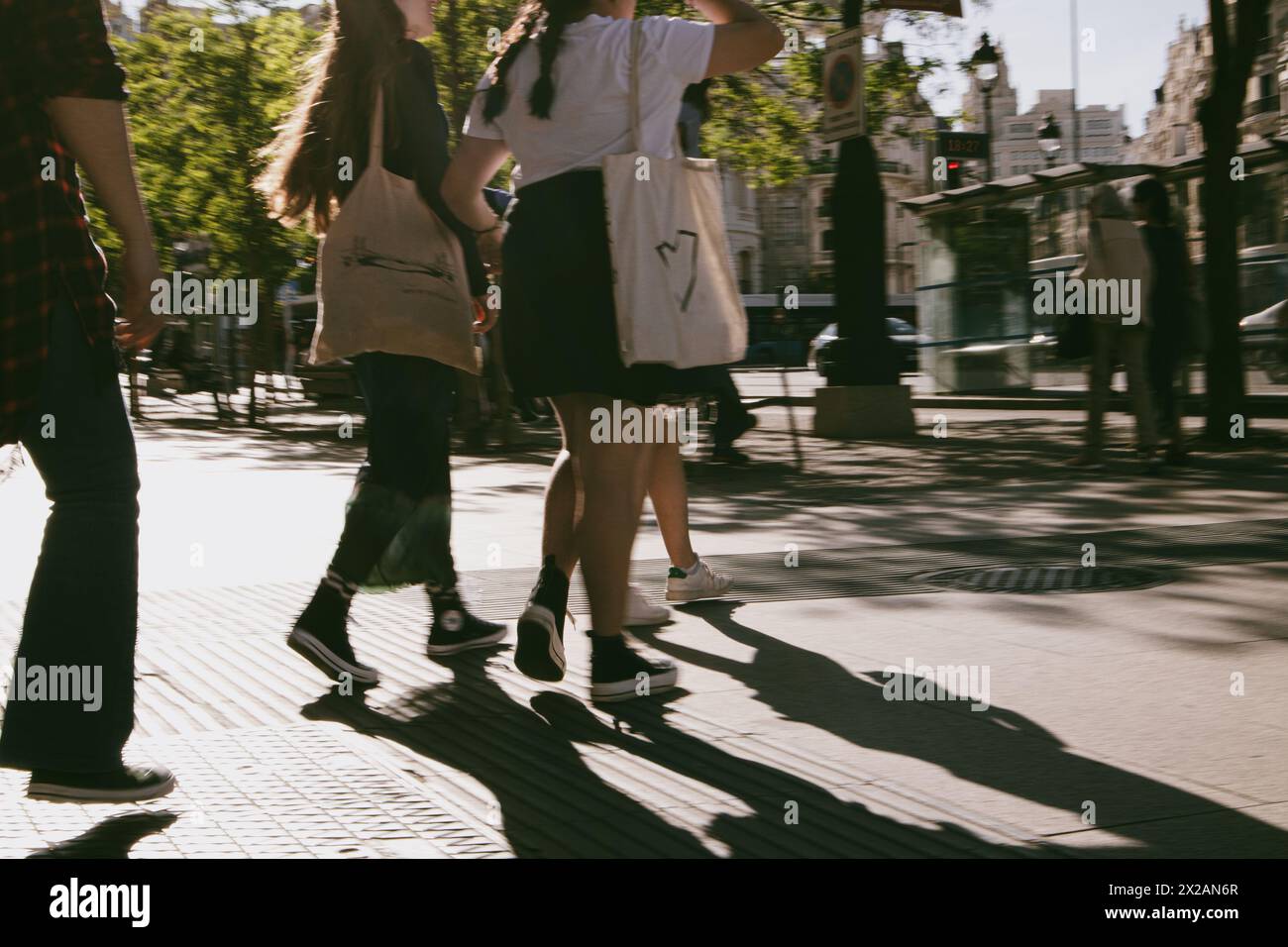 Madrid Spain. 2 April 2024 Residents pedestrians walking on city street ...