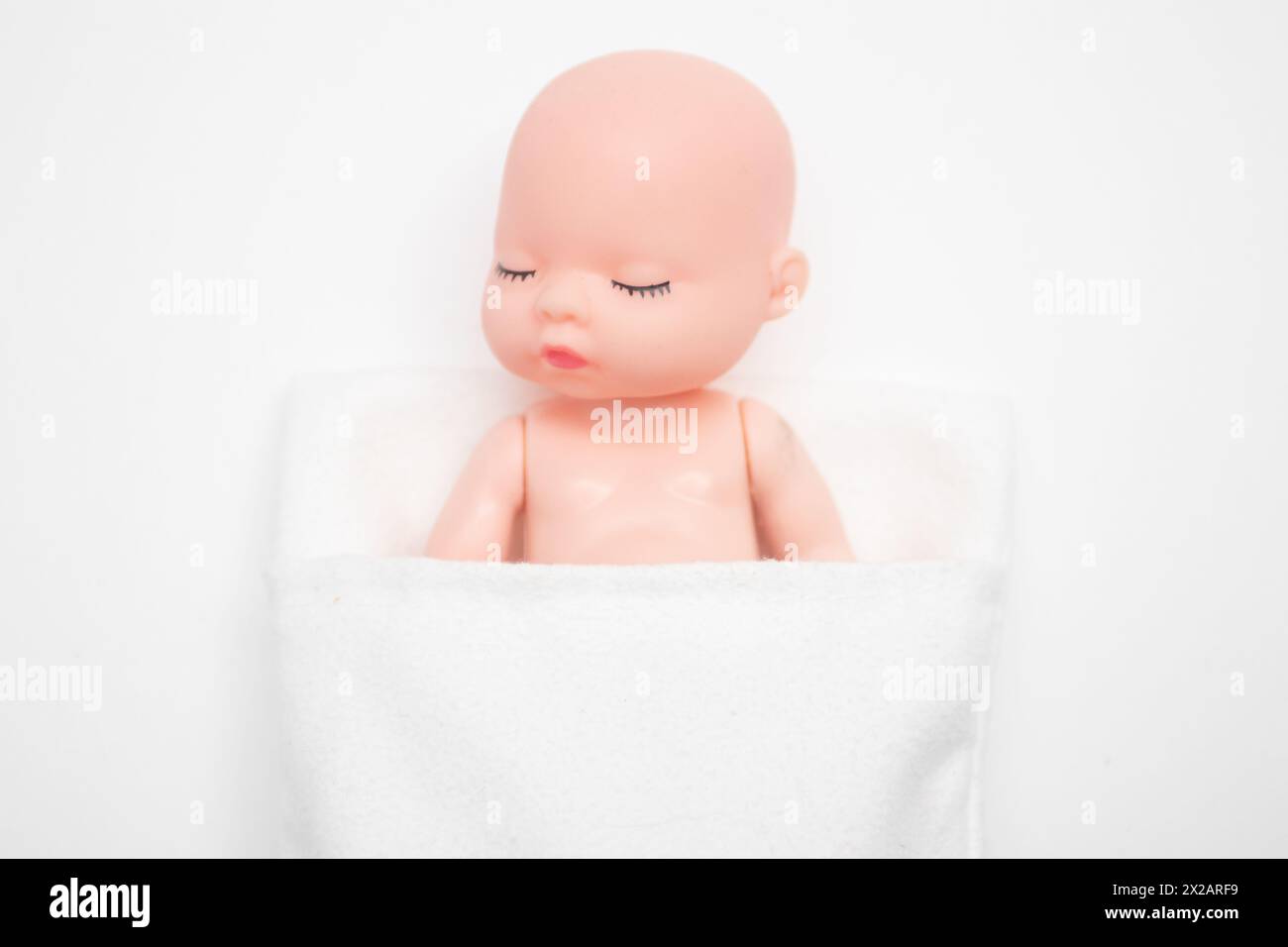 the little doll baby is sleeping Stock Photo - Alamy