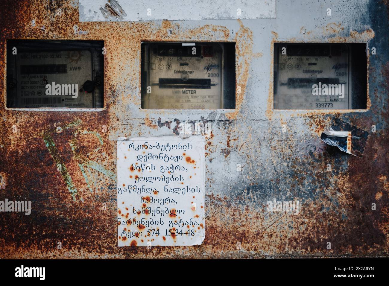 Details of of a rusty gas meter in Tbilisi Georgia. The text says ...