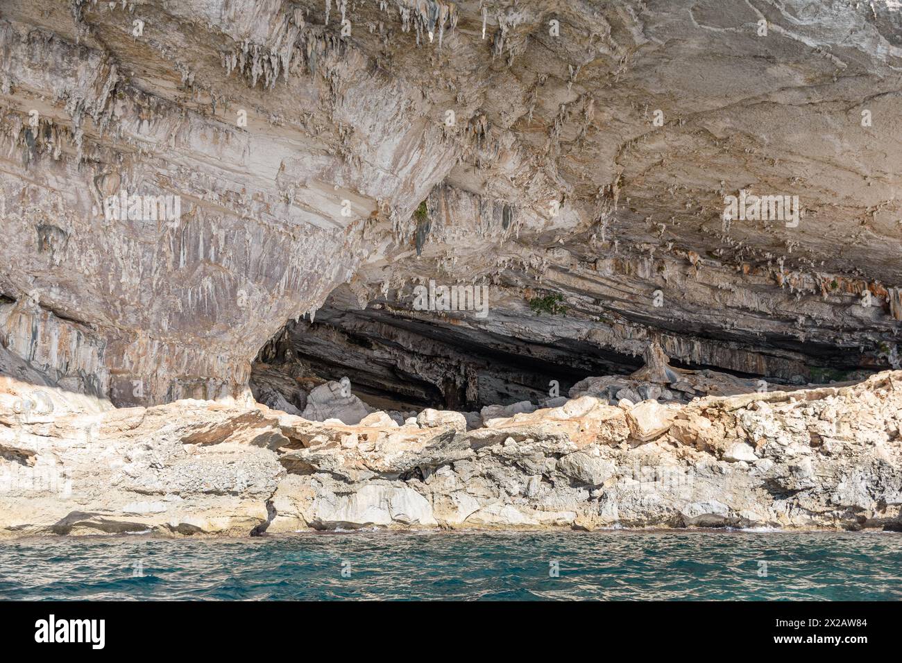 Cave along the cliffed coast in the Baunei area in east Sardinia; the ...
