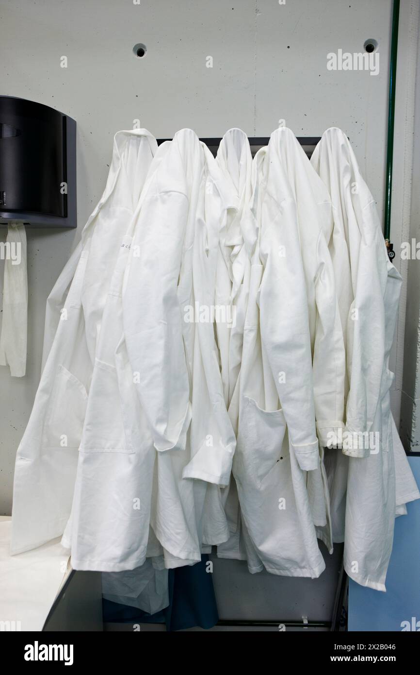 White lab coat hanging hi-res stock photography and images - Alamy