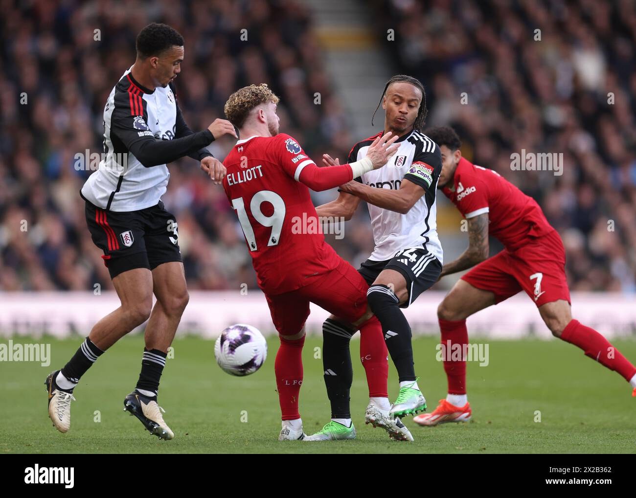 London, England, 21st April 2024. Harvey Elliott of Liverpool tackled by Antonee Robinson of ...