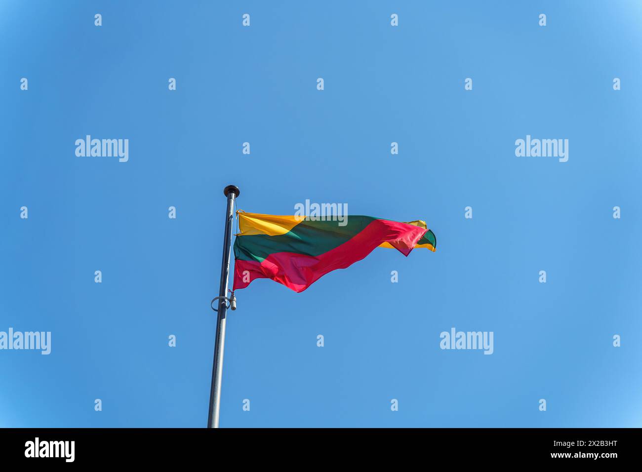 Lithuanian national flag waving on blue sky background. Republic of ...