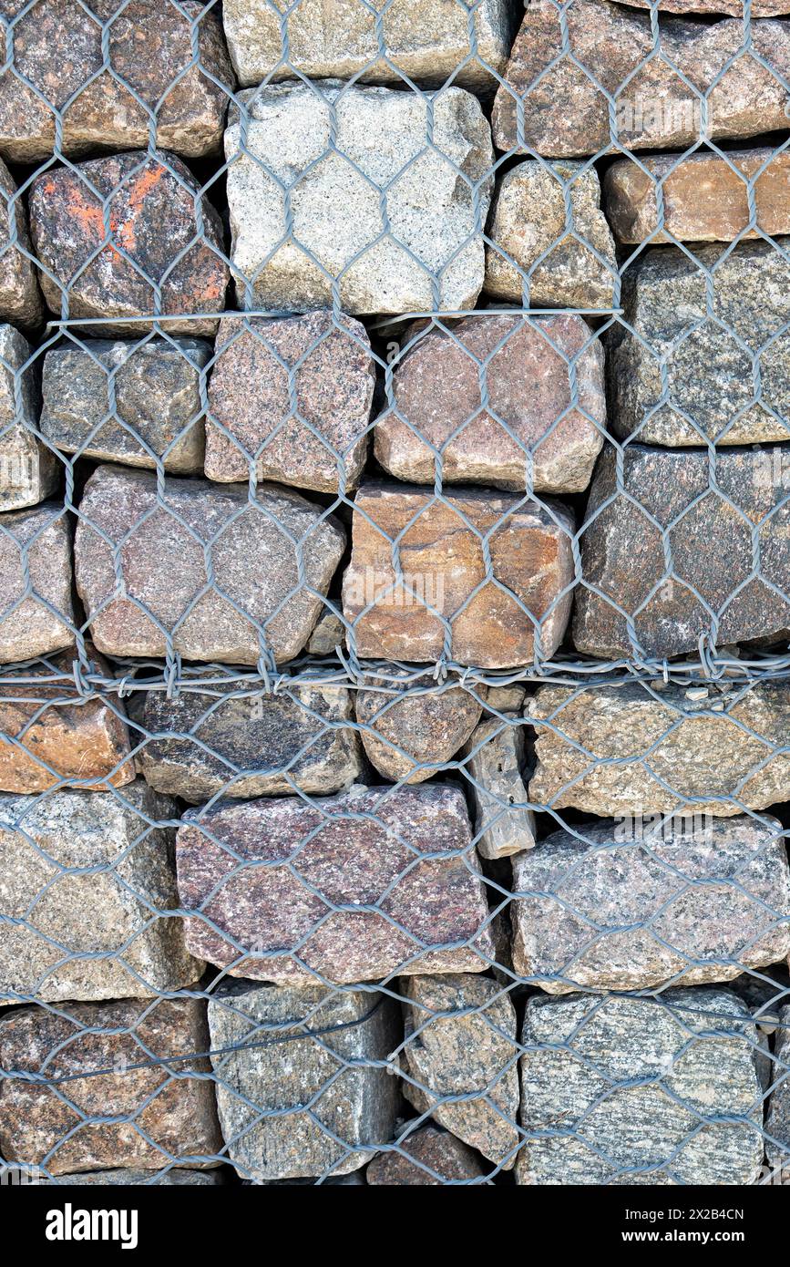 Texture of a gabion wall, cages filled with rocks Stock Photo - Alamy