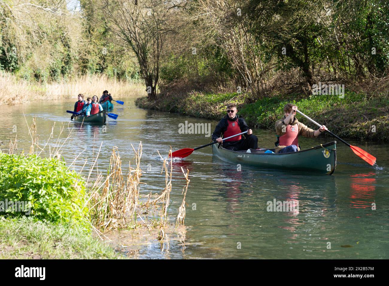 Young people canoeing on the Basingstoke Canal, a recreational canal ...