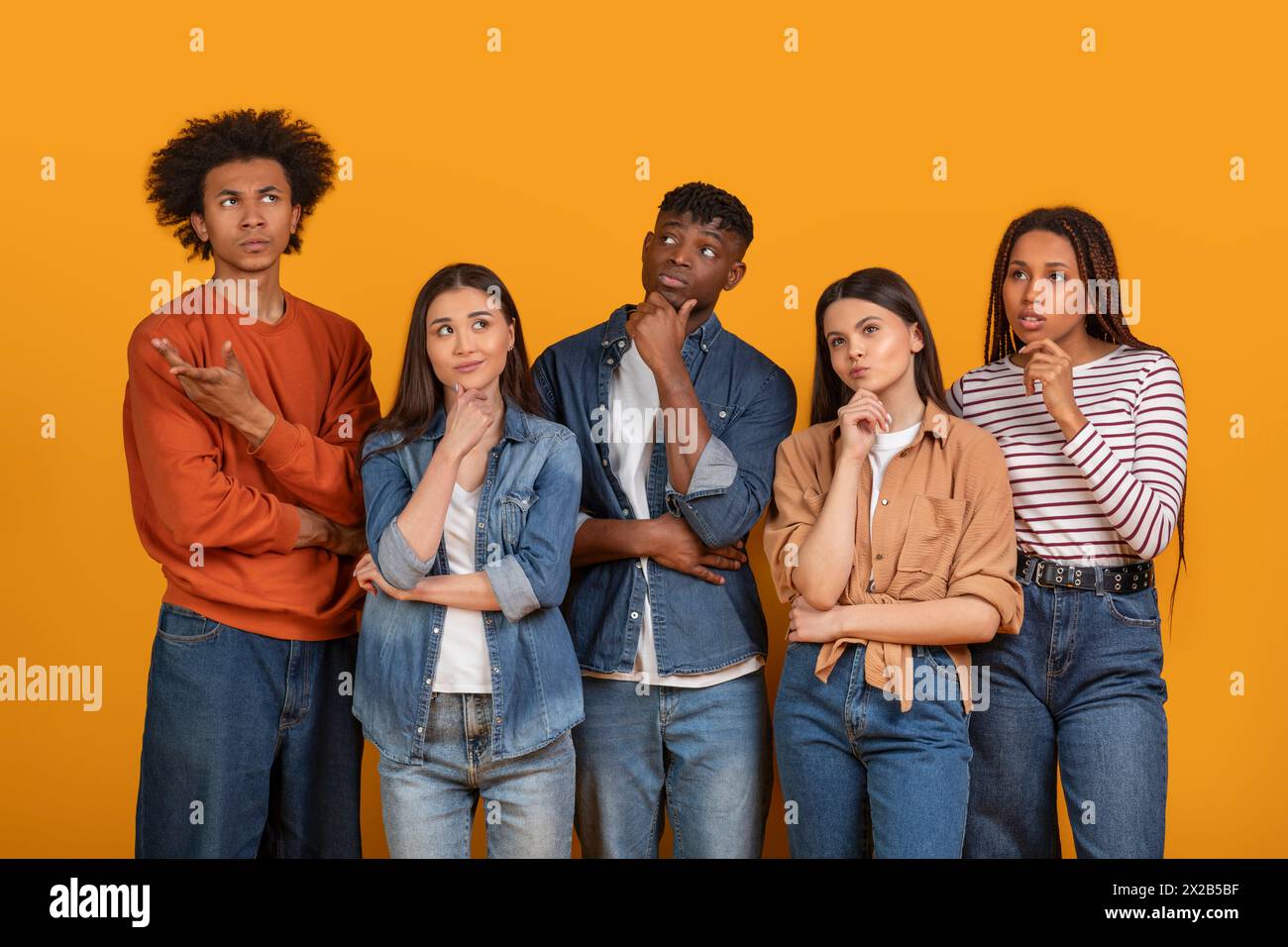 Group of five young people posing thoughtfully Stock Photo - Alamy