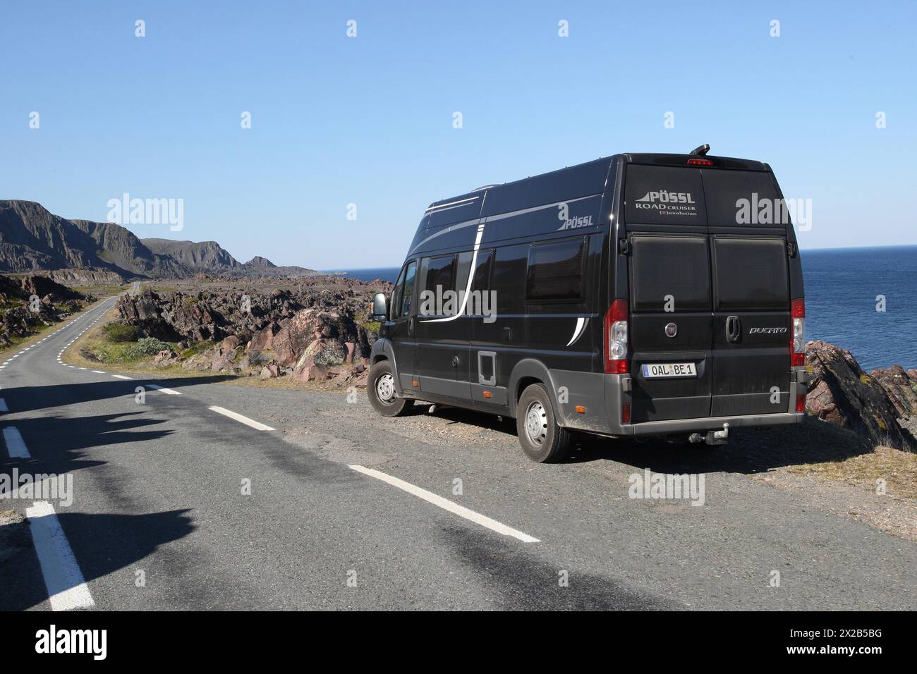 Camper, motorhome on the single-lane coastal road to Hamningberg on the ...