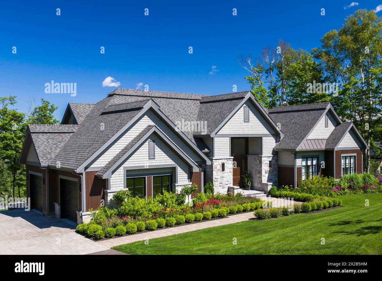 Contemporary natural stone and brown stained wood and cedar shingles ...