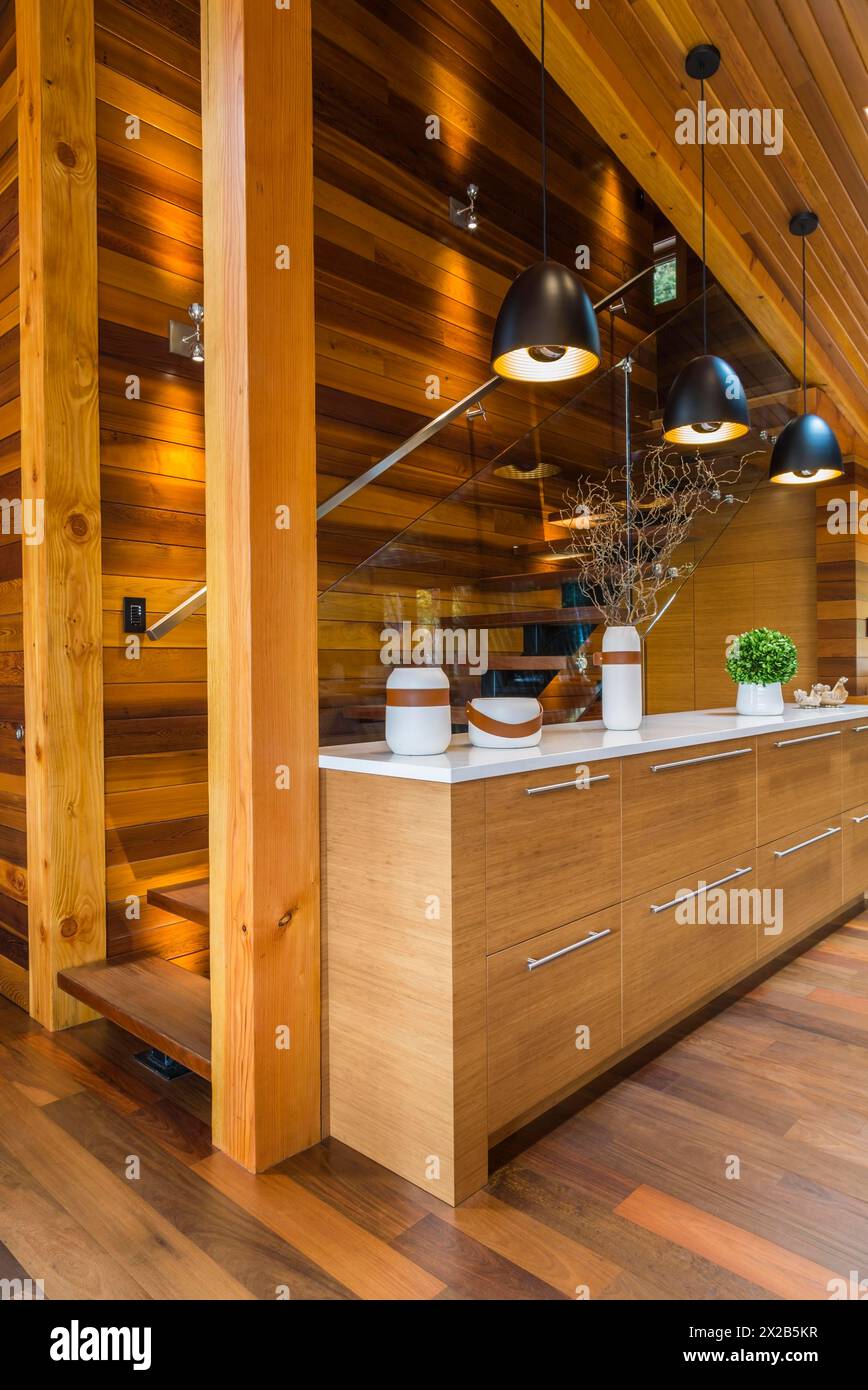 Bamboo wood buffet with white quartz countertop illuminated by black ...