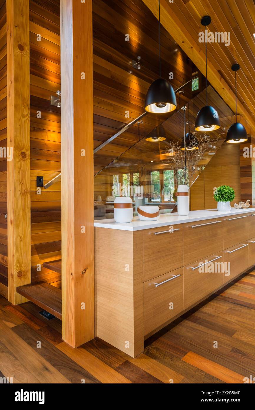 Bamboo wood buffet with white quartz countertop illuminated by black ...
