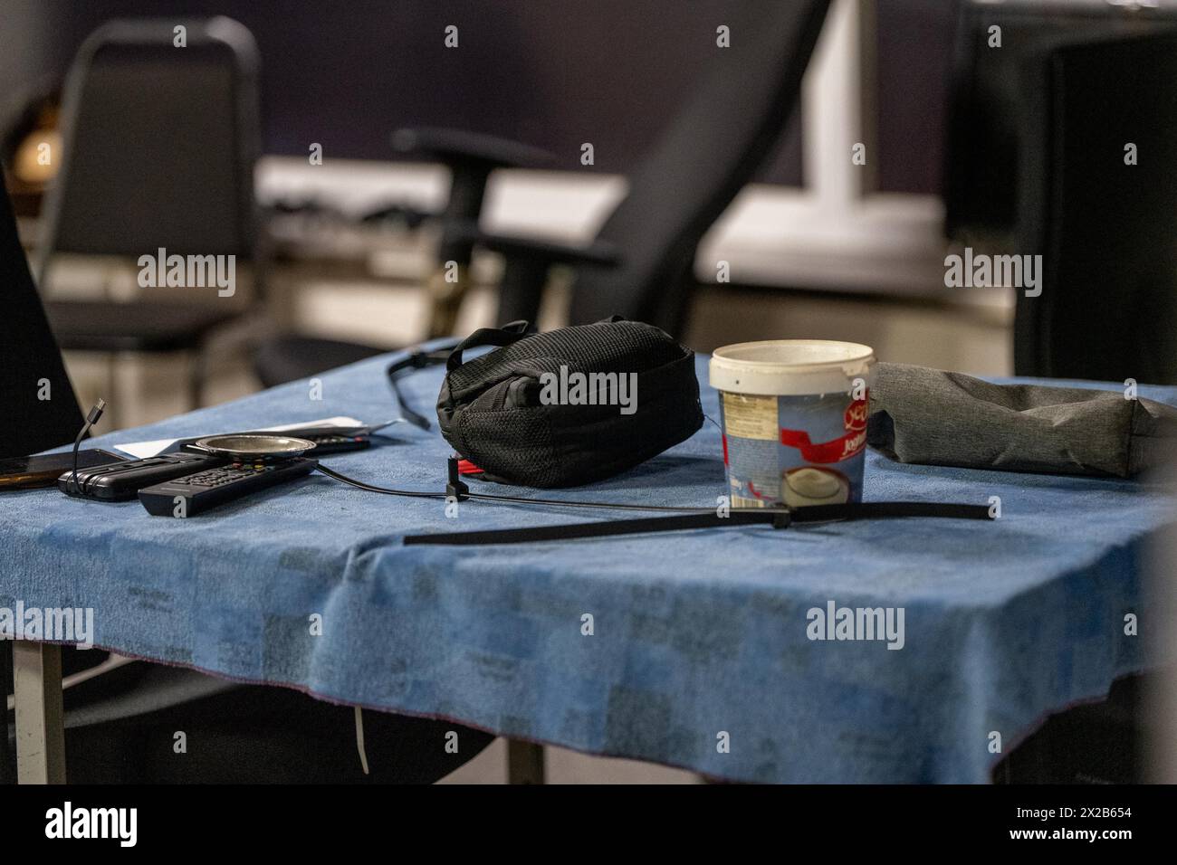 A table with personal belongings and a disposable coffee cup, Cologne ...