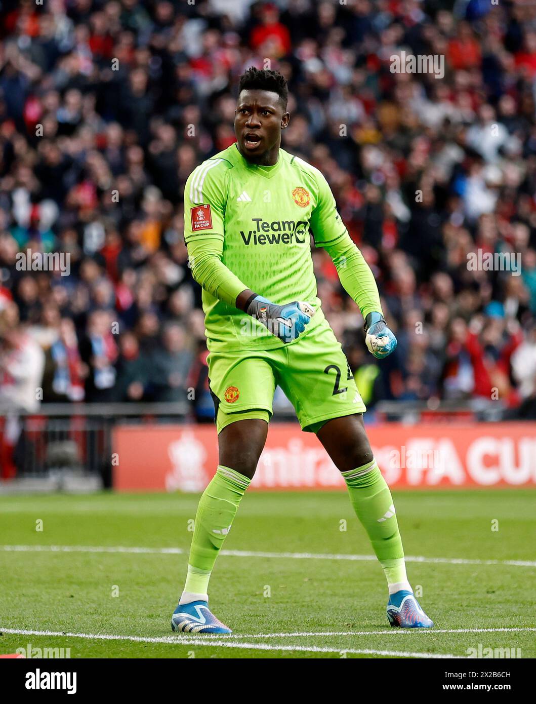 Manchester United goalkeeper Andre Onana celebrates saving a penalty in ...