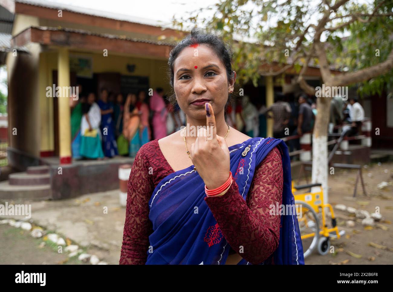BOKAKHAT, INDIA, APRIL 19: A women show her marked finger after casting ...