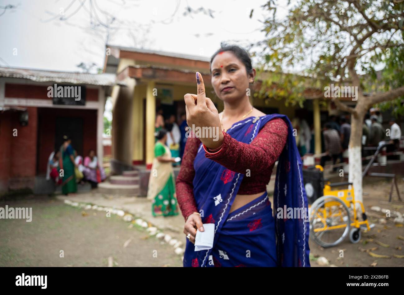 BOKAKHAT, INDIA, APRIL 19: A women show her marked finger after casting ...