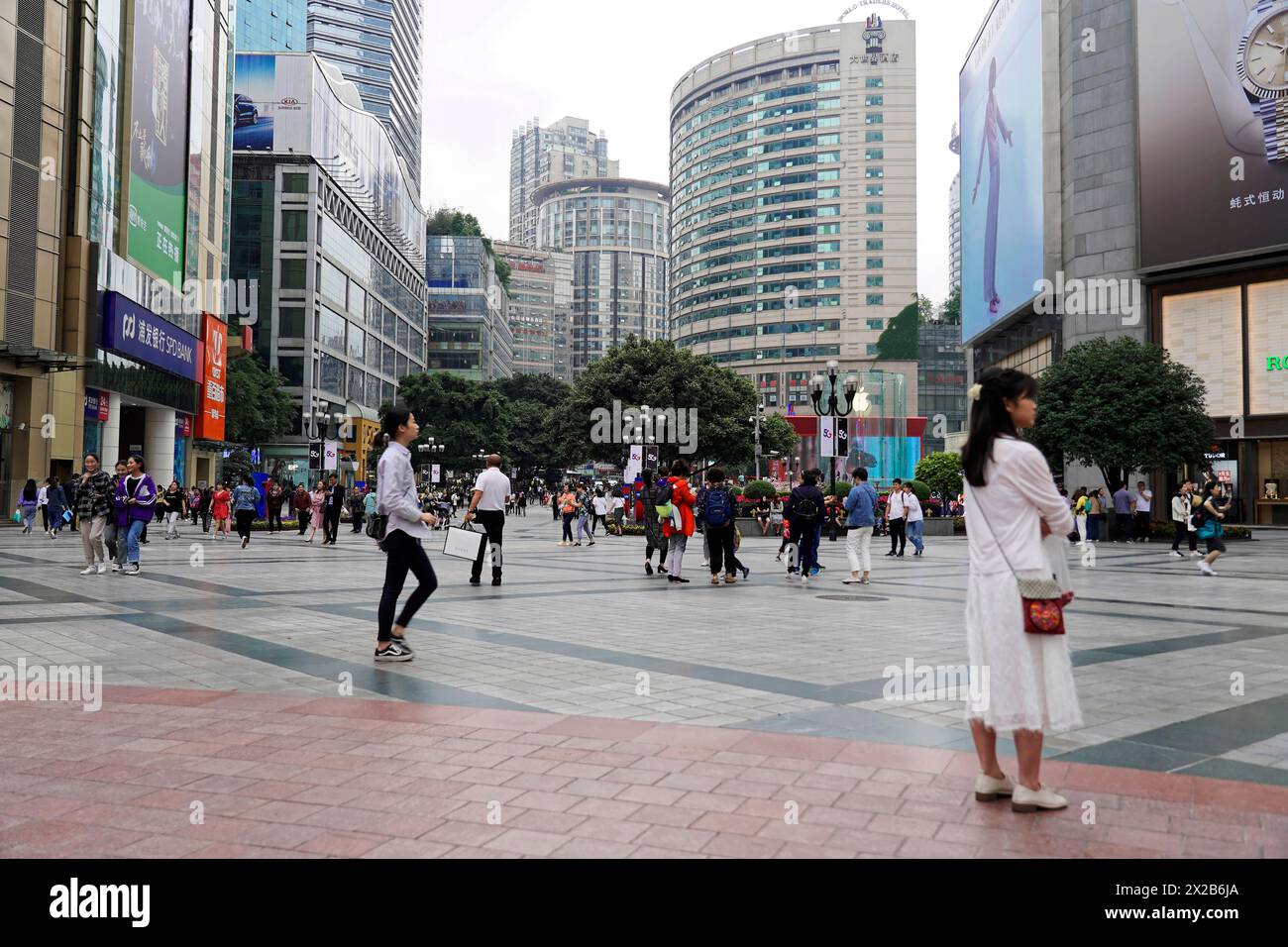 Chongqing, Chongqing Province, China, Asia, People walking across a ...